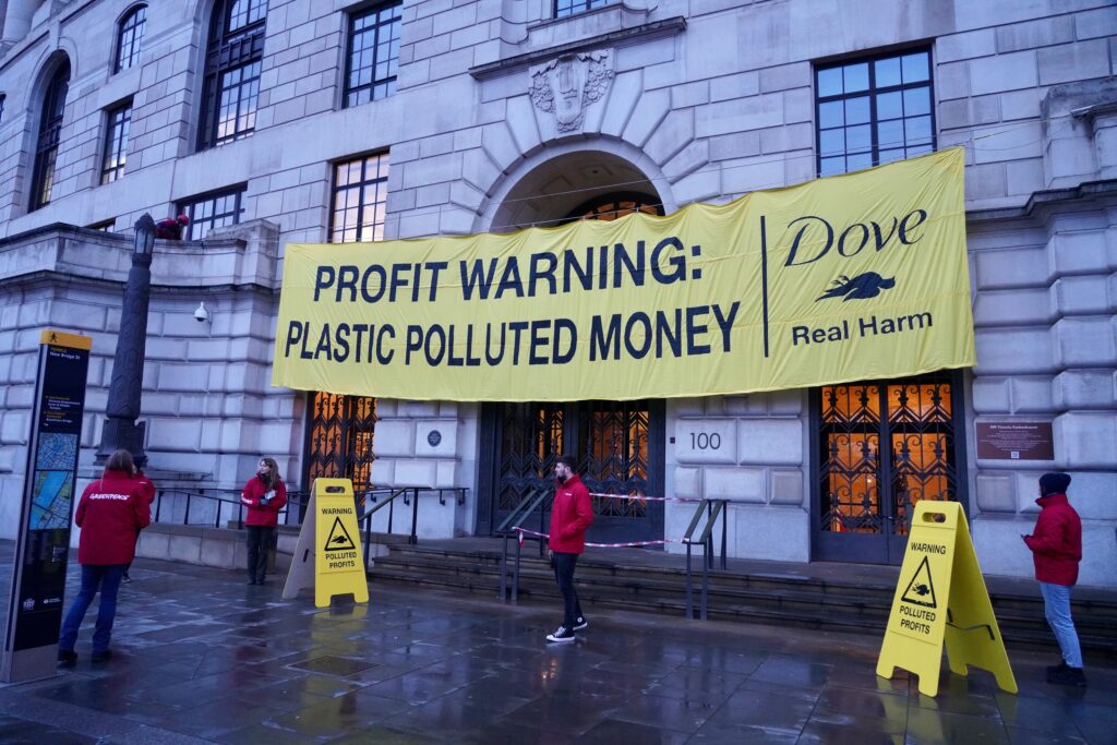 Unilever profit warning delivered by Greenpeace UK as activists scale ...